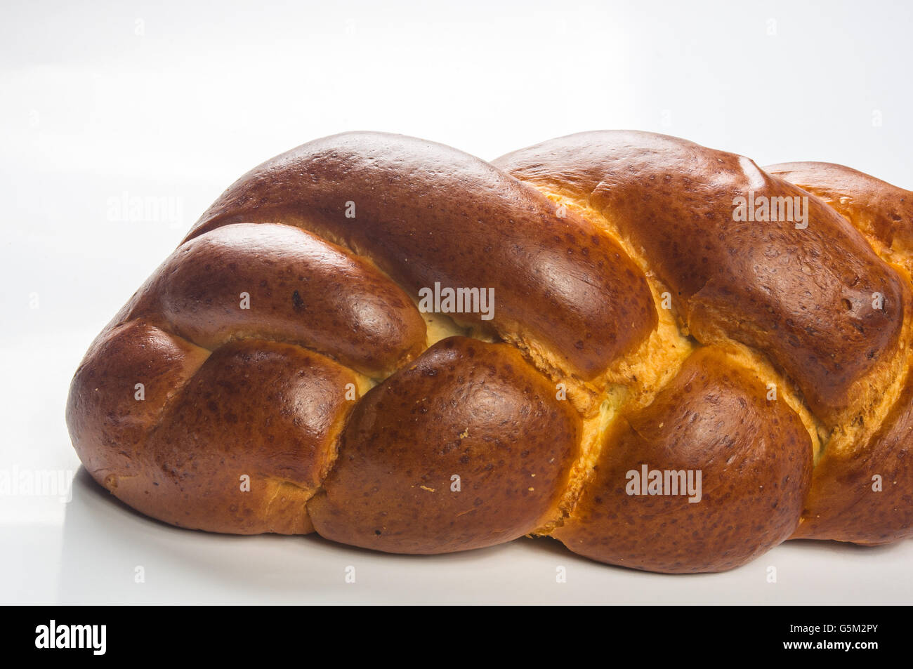 chunks large braided loaf on white background Stock Photo - Alamy