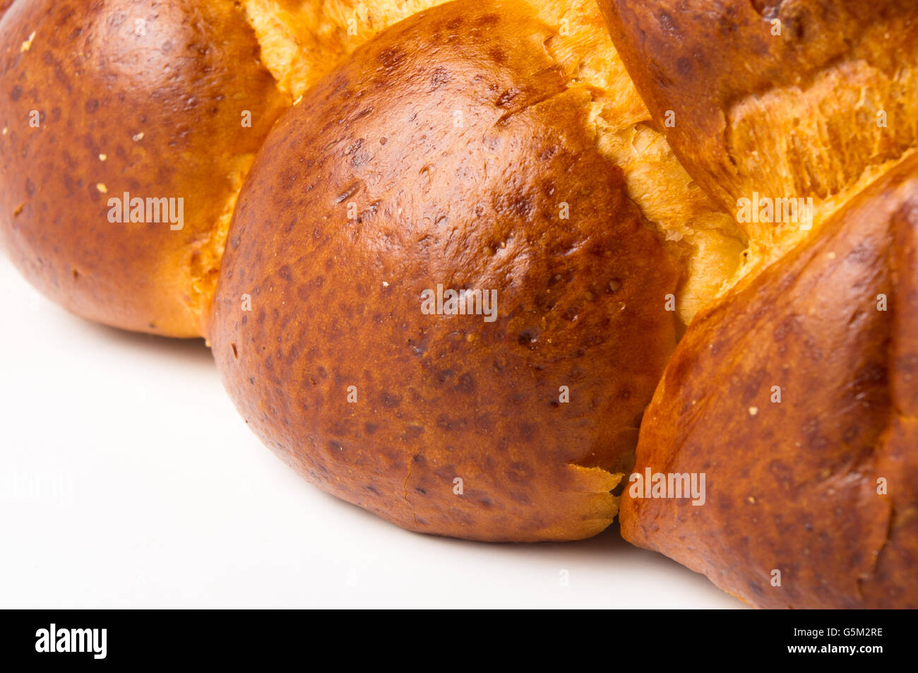 chunks large braided loaf on white background Stock Photo - Alamy