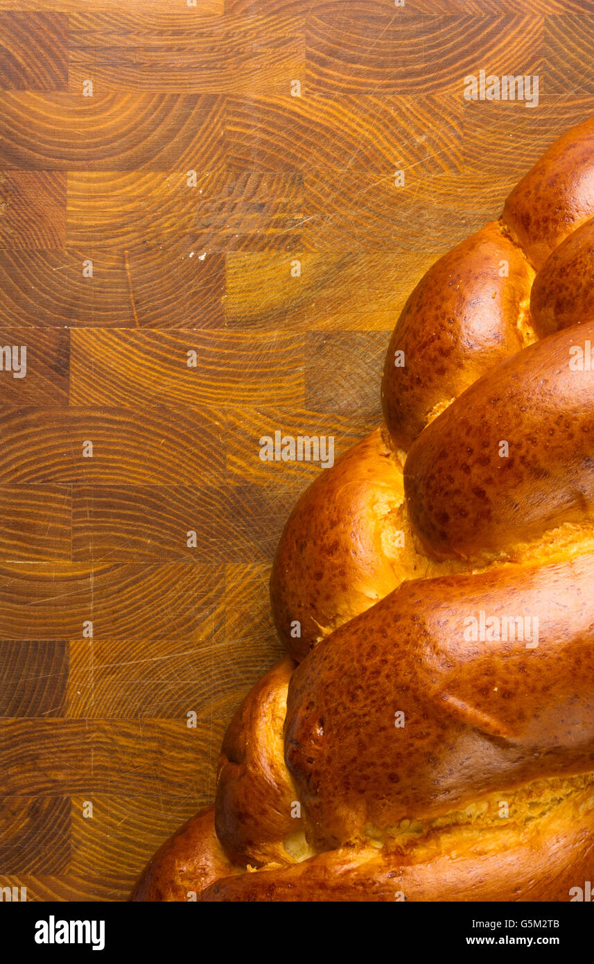 chunks large braided loaf on wooden background Stock Photo - Alamy