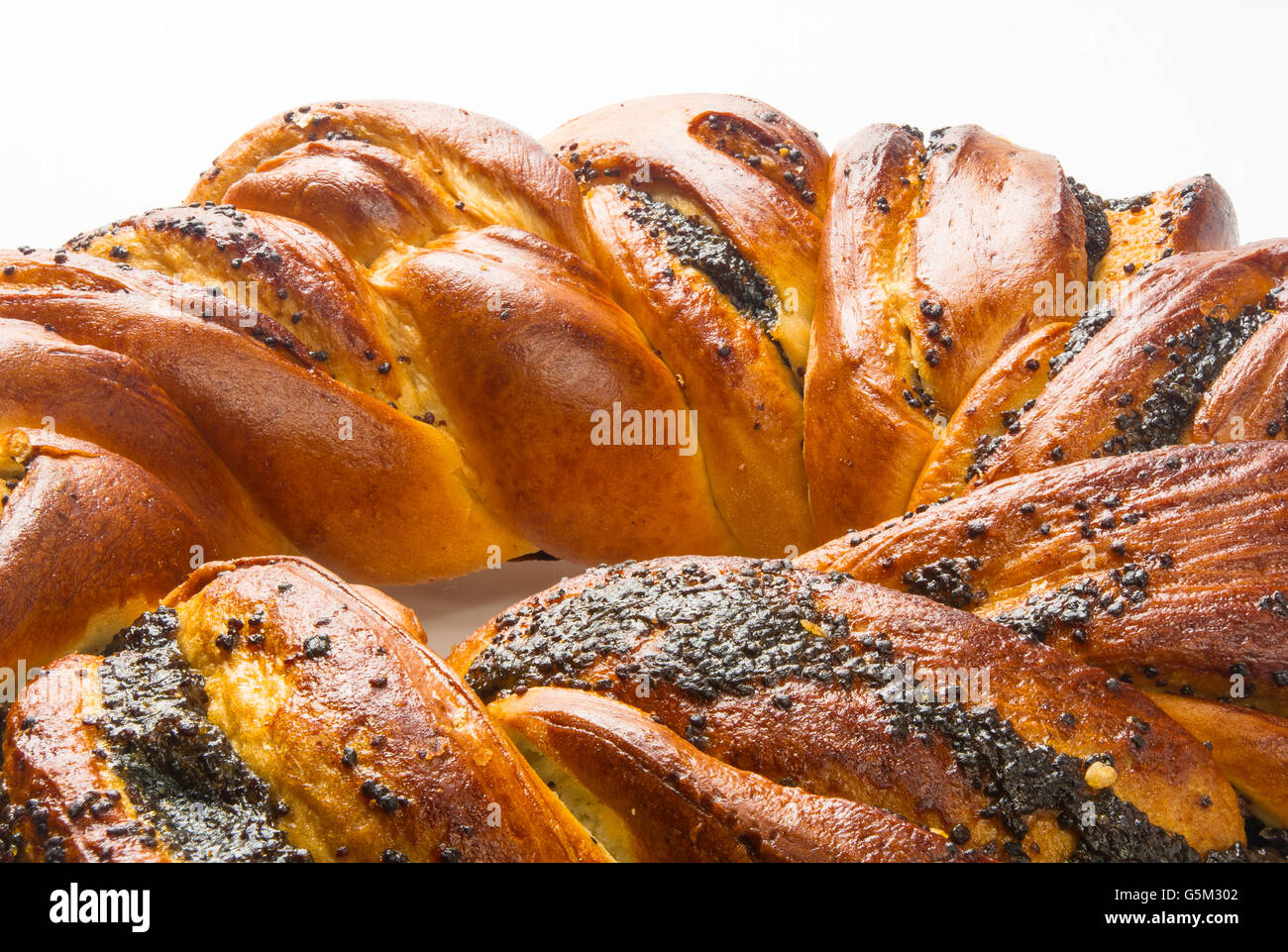 braided poppy seed round loaf on white background Stock Photo - Alamy