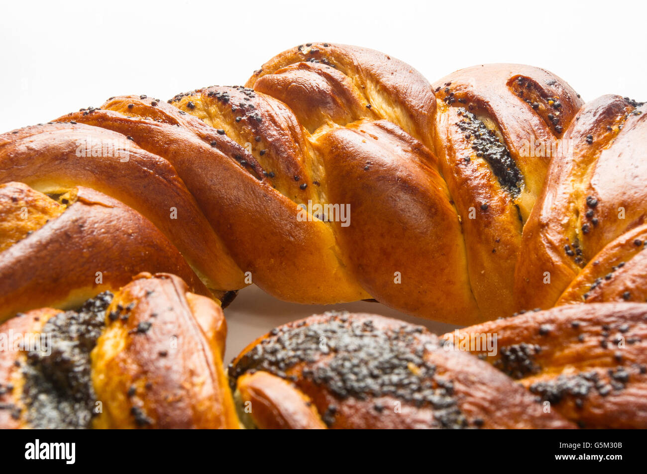 braided poppy seed round loaf on white background Stock Photo - Alamy