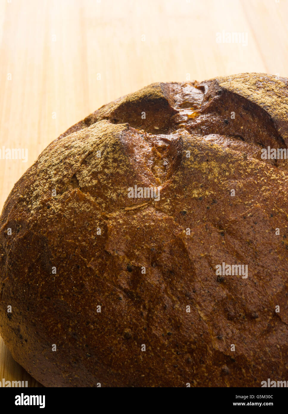 dark bread with crumbs on wood board Stock Photo - Alamy