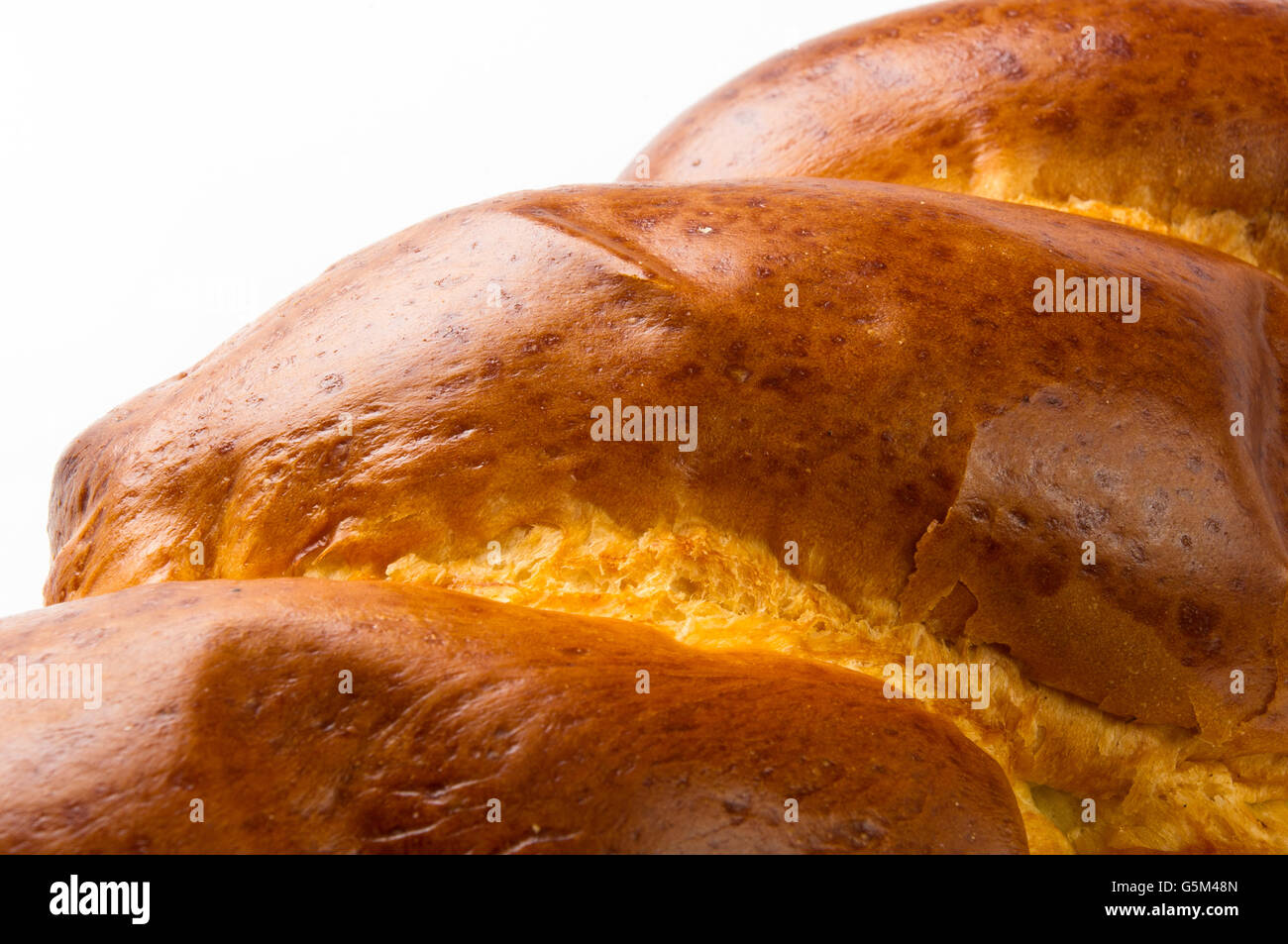 chunks large braided loaf on white background Stock Photo - Alamy