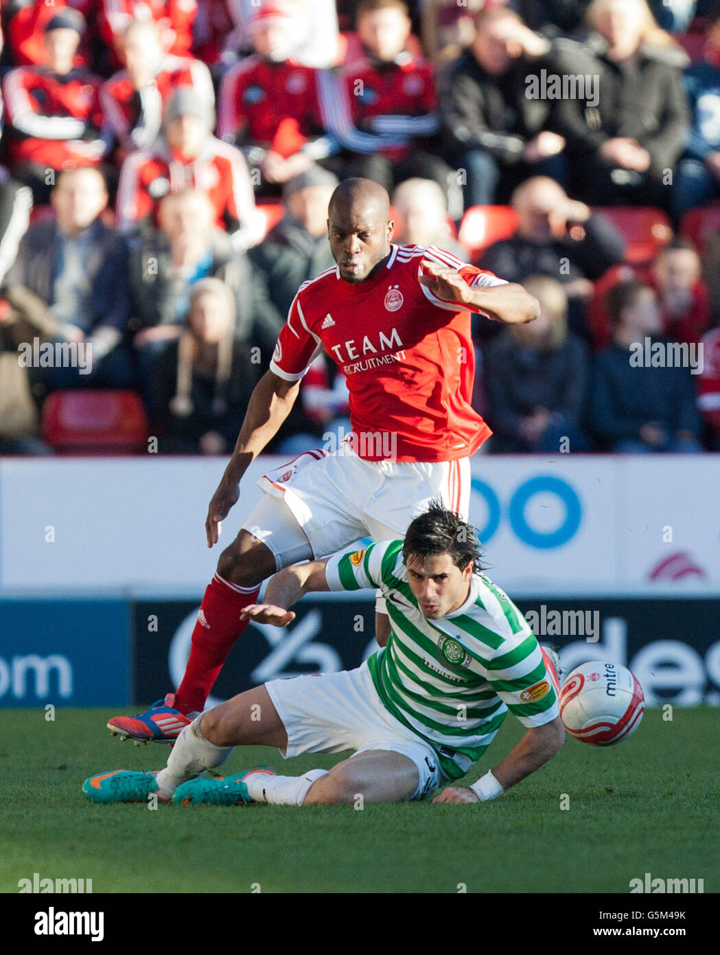 Aberdeen's Isaac Osbourne battles with Celtic's Beram Kayal (bottom ...