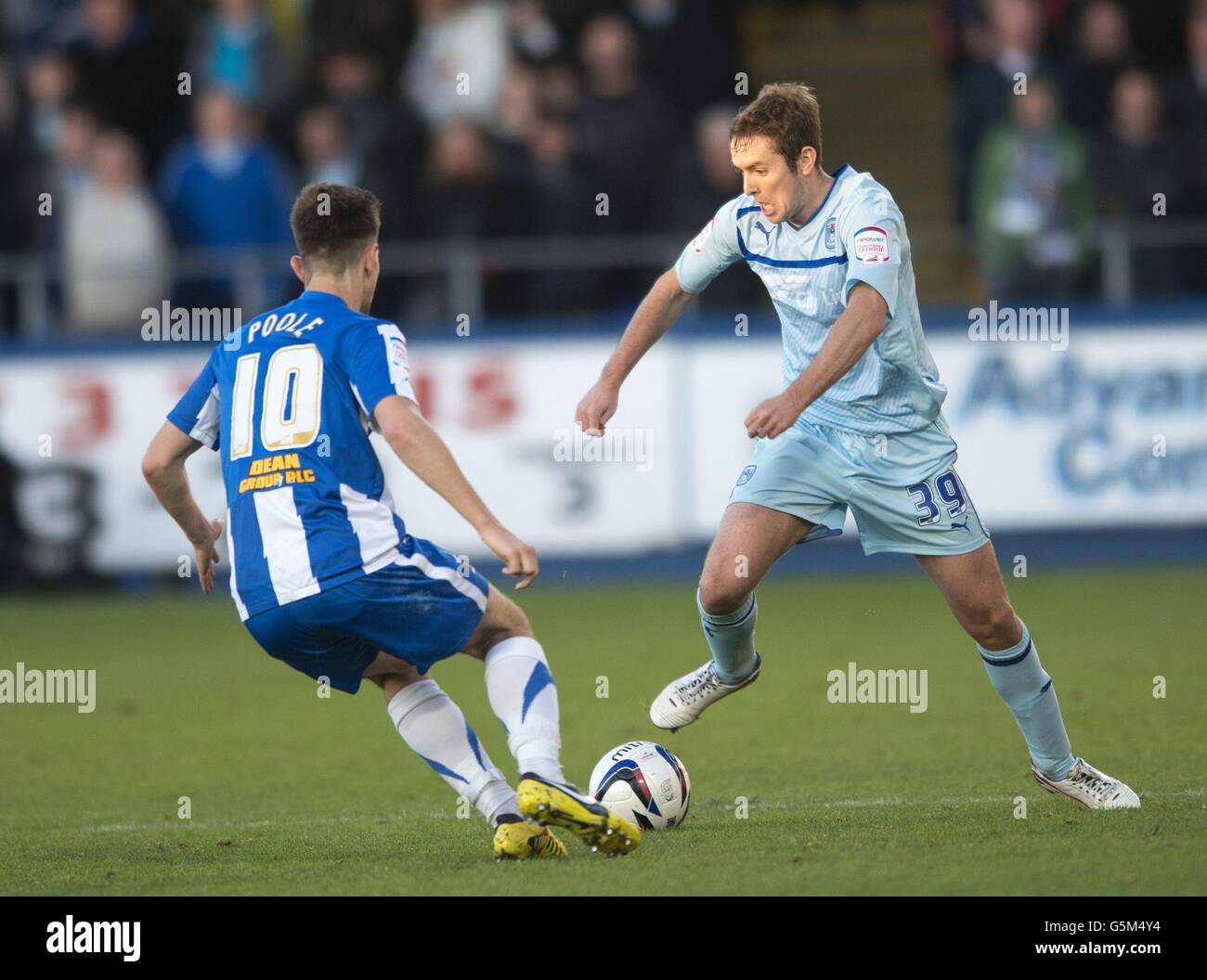 Hartlepool United's James Poole and Coventry City's Blair Adams (right ...