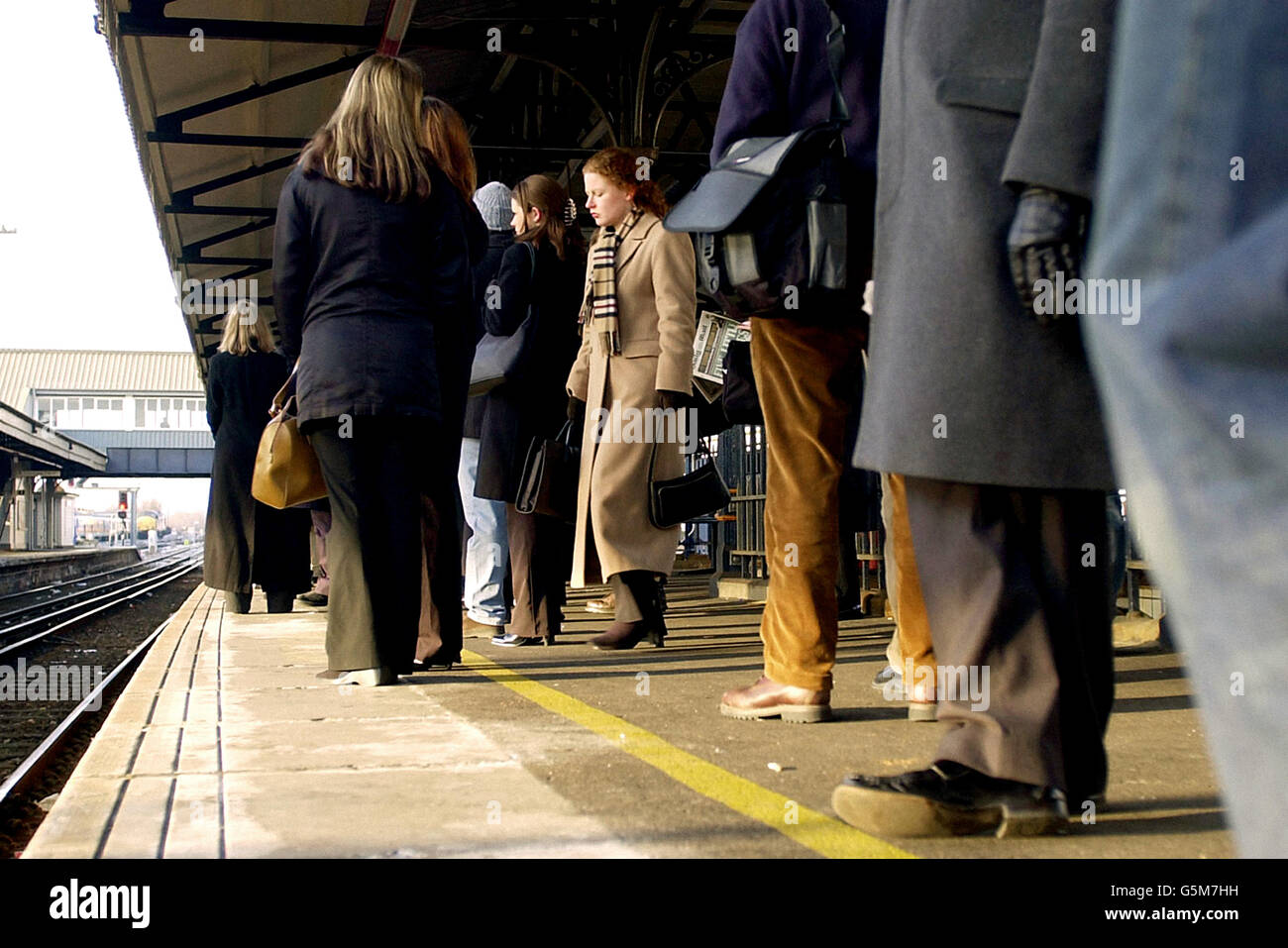 Commuters and rail passengers wait for a delayed South West Trains ...
