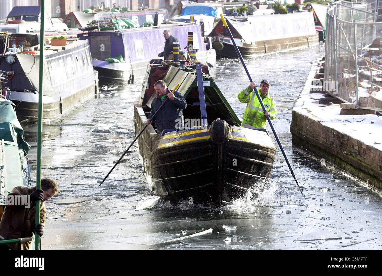 British Waterways Icebreaker boat, The Barnet, drives through the ice ...