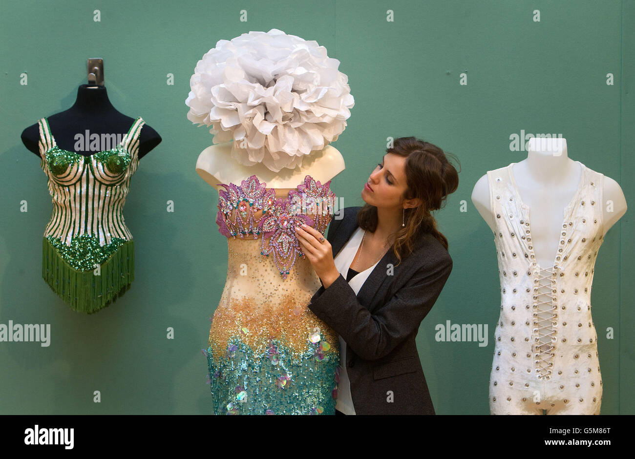 A Christie's specialist arranging a crystal-encrusted mermaid costume ...