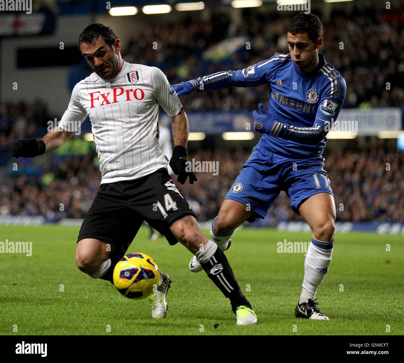 Fulham's Giorgos Karagounis (left) and Chelsea's Eden Hazard battle for ...