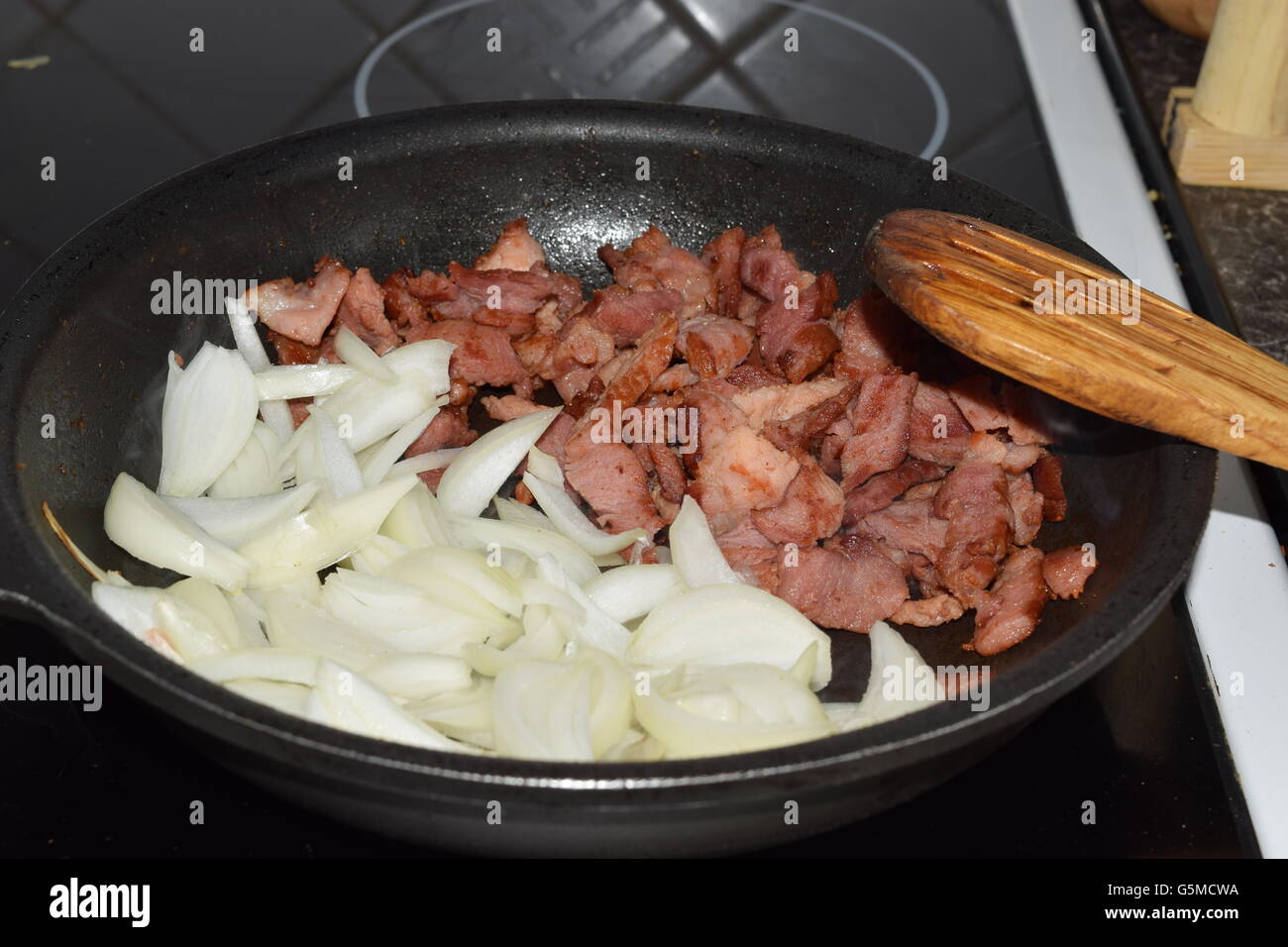 Onion and Seasoned Meat Cooking in a Frying Pan Stock Photo - Alamy