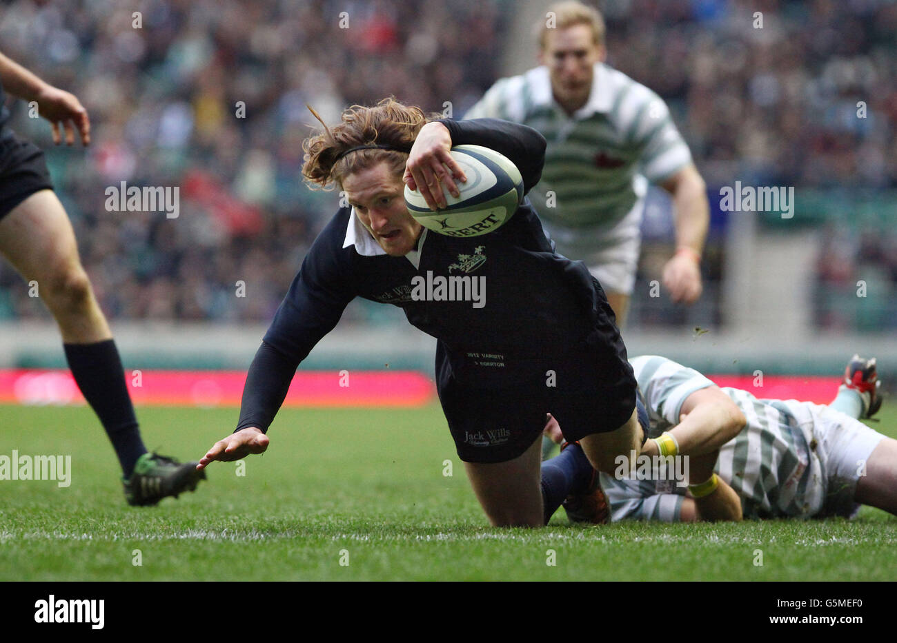 Oxford's Sam Egerton dives over the line to score a try during the ...