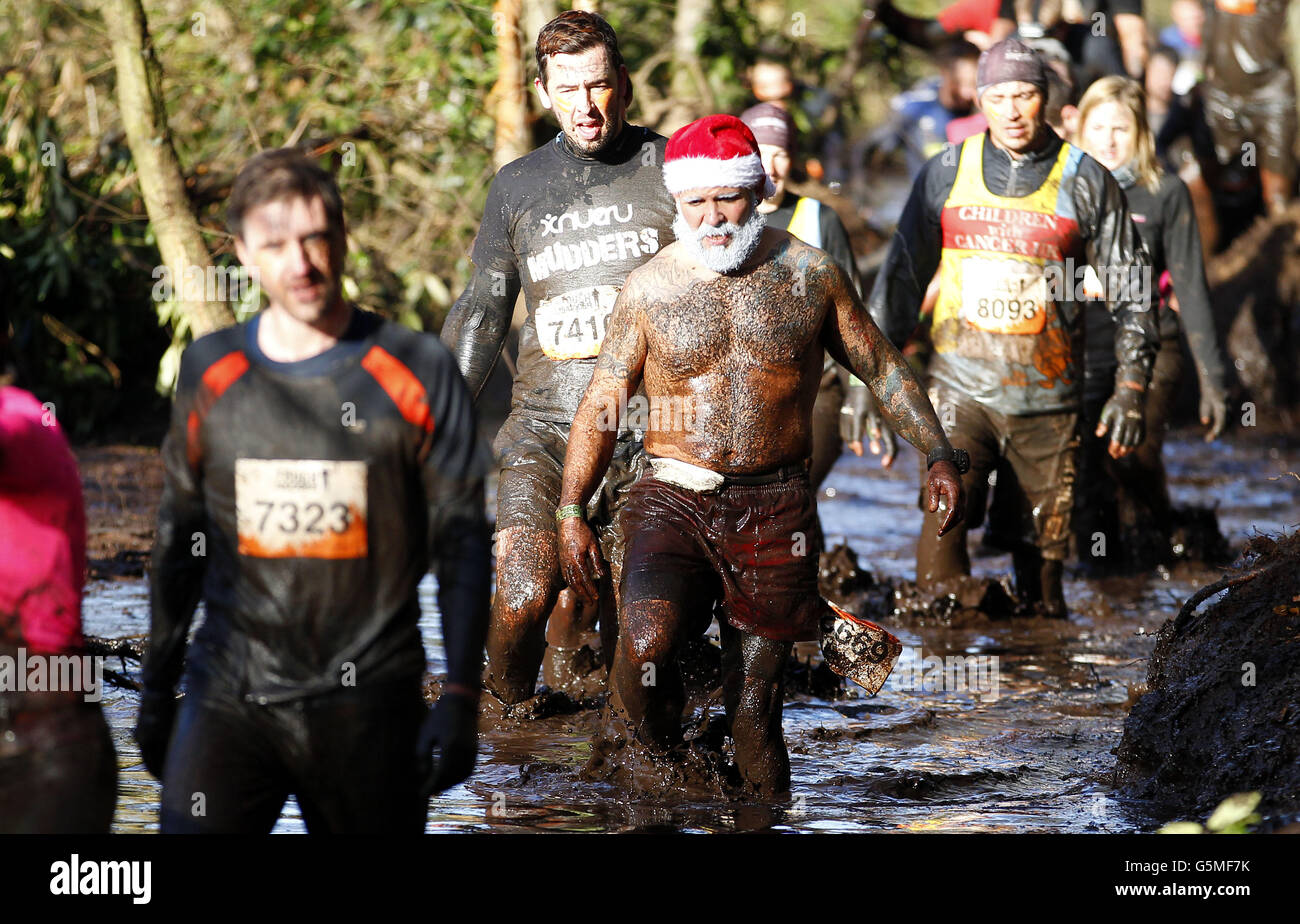 Competitors make their way through Mud Mile during the Tough Mudder ...