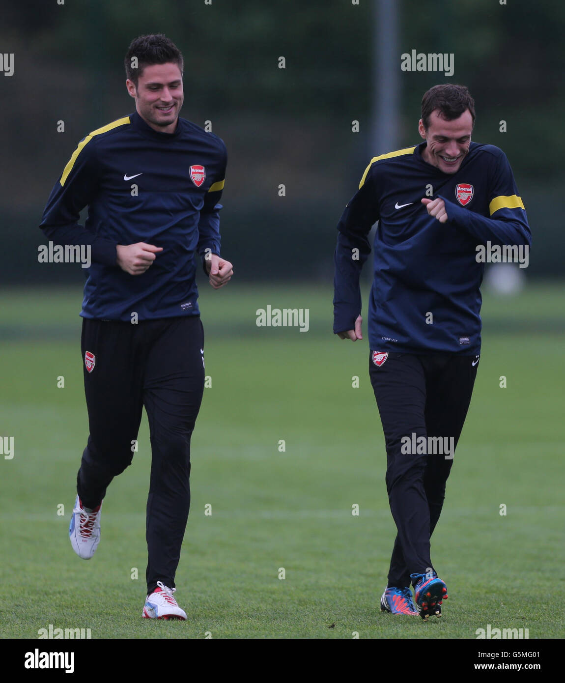 Arsenal's Olivier Giroud (left) trains with Sebastien Squillaci (right ...