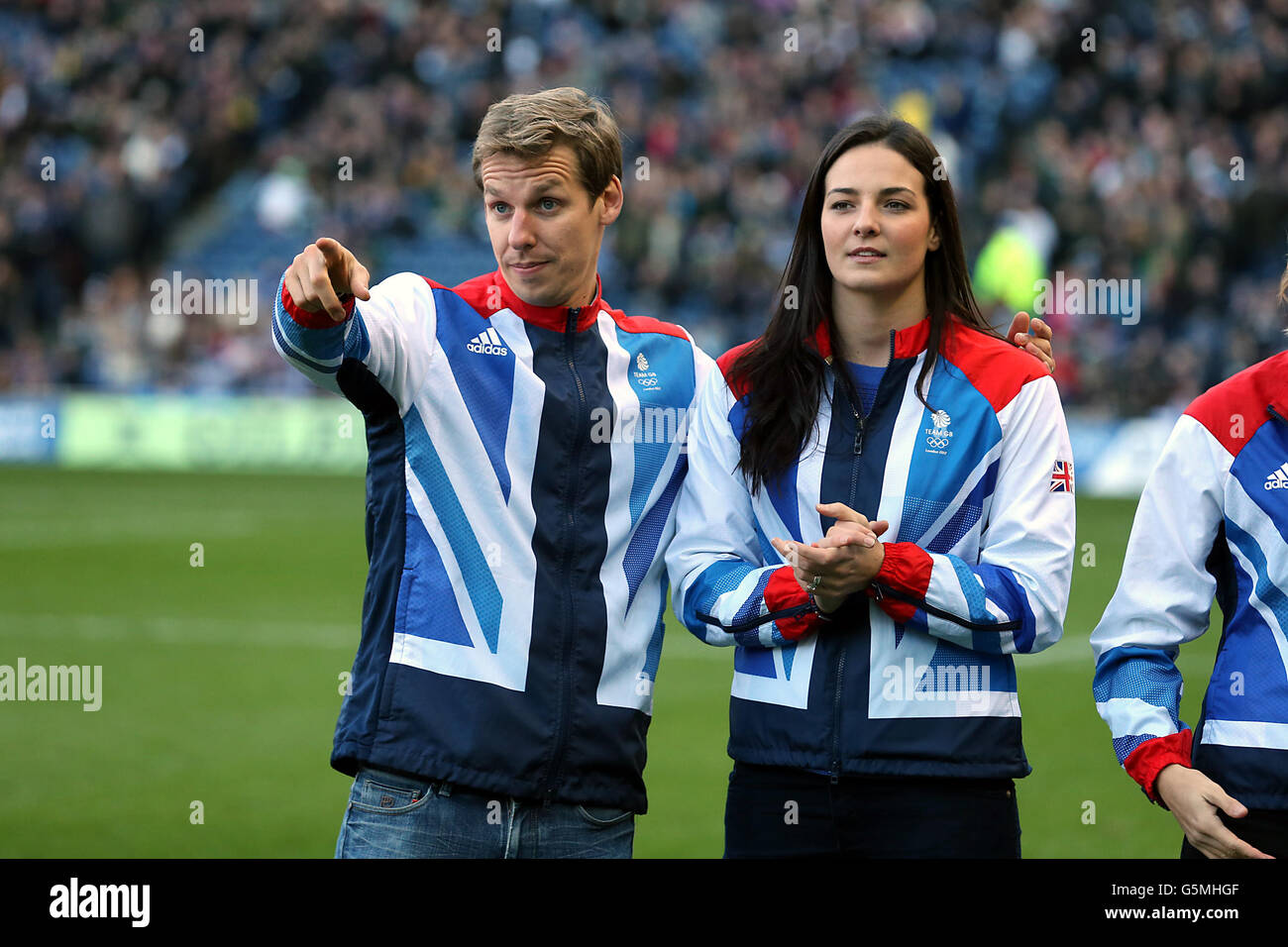 Team GB's David Carry (left) and Keri-Anne Payne form a guard of honour ...