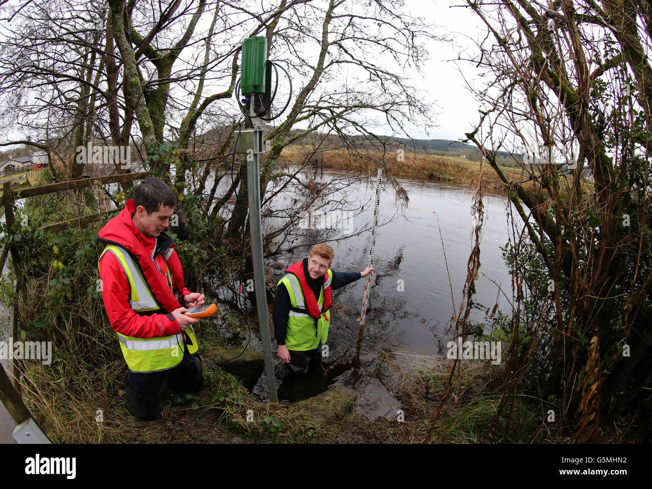 Hydrologists Andrew Picken and Josh Johnstone (holding water staff ...