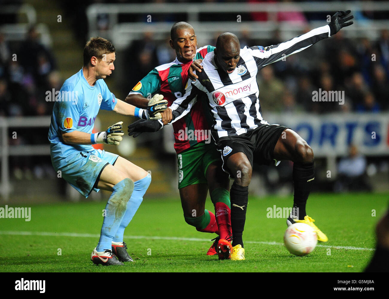 Newcastle United's Demba Ba and Maritimo's Marcio Rosario during the ...