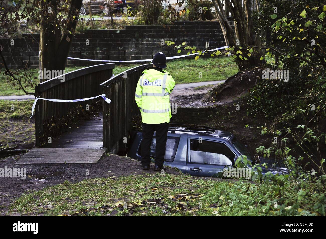 A police officer at the scene where a man died after becoming trapped ...