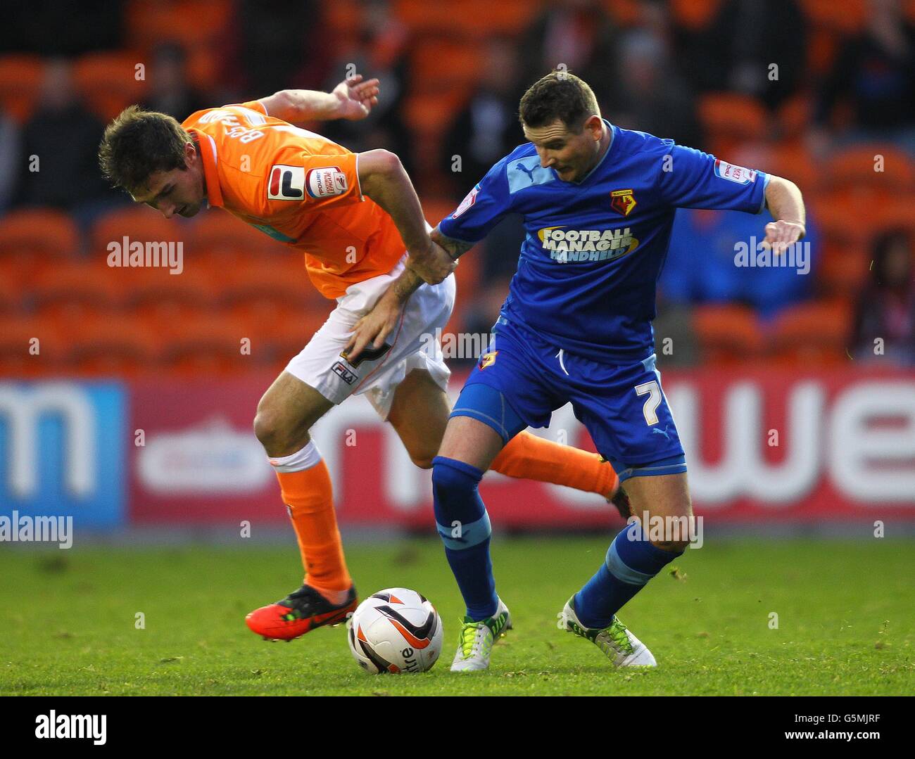 Blackpool's Chris Basham and Watford's Mark Yeats (right) battle for ...