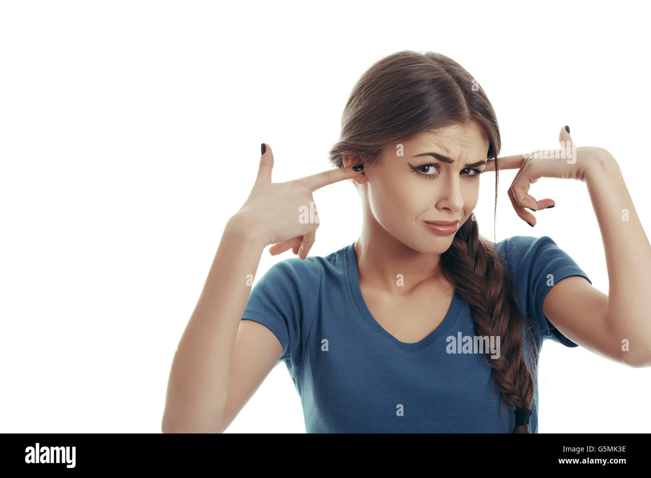 Pretty Woman With Disgust Grimace Sticks Her Fingers In Her Ears