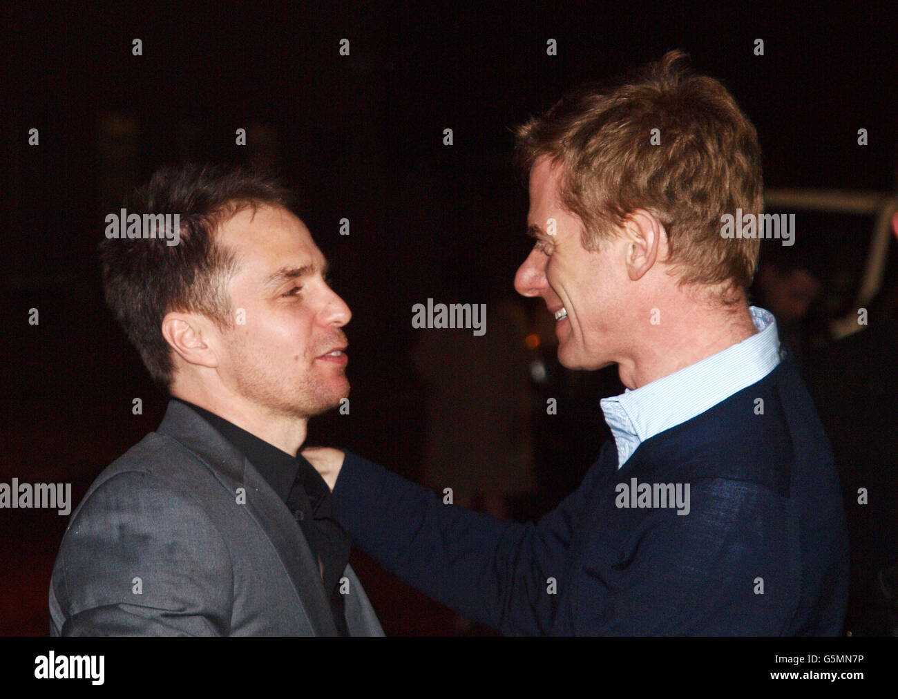 Sam Rockwell (left) greets producer Graham Broadbent as they arrive at ...
