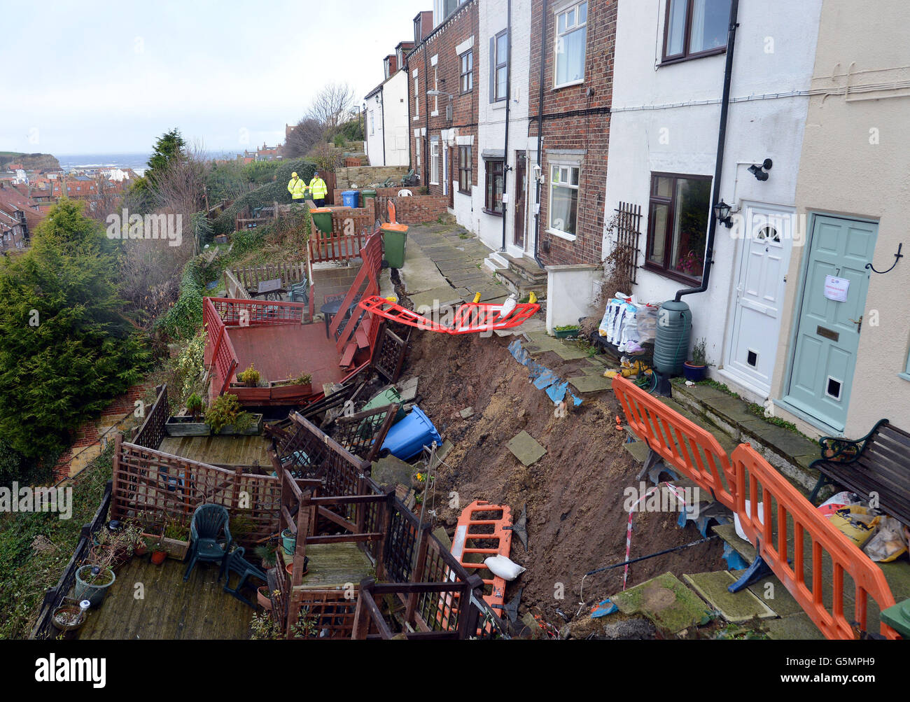 A row of seven cottages high above Whitby harbour are collapsing down ...