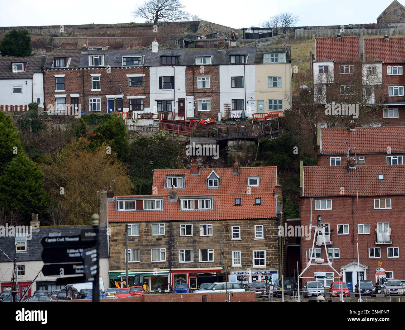 A row of seven cottages high above Whitby harbour are collapsing down ...