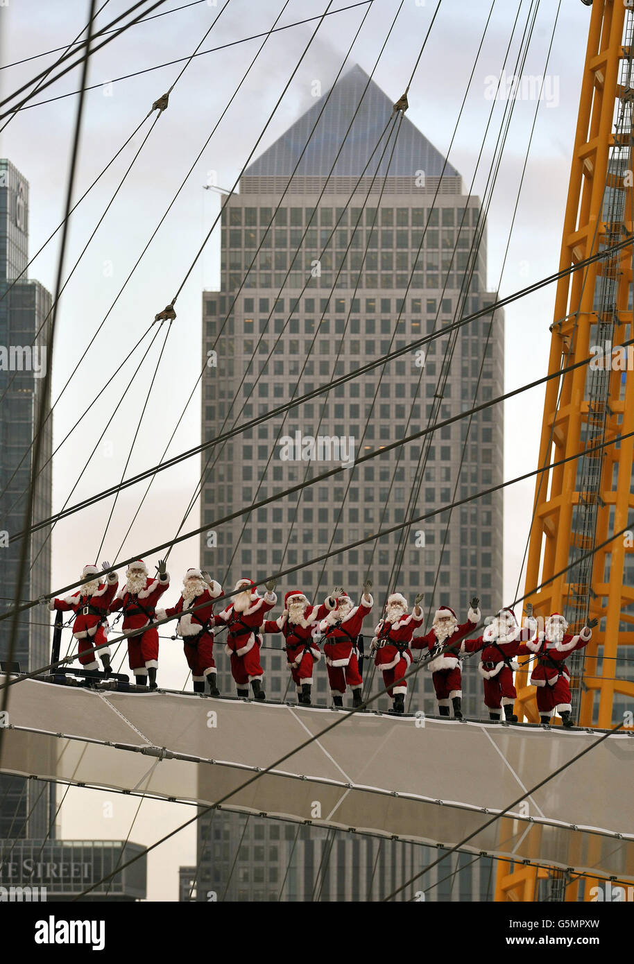 Ten professional Santas finish their pre-Christmas training by scaling ...