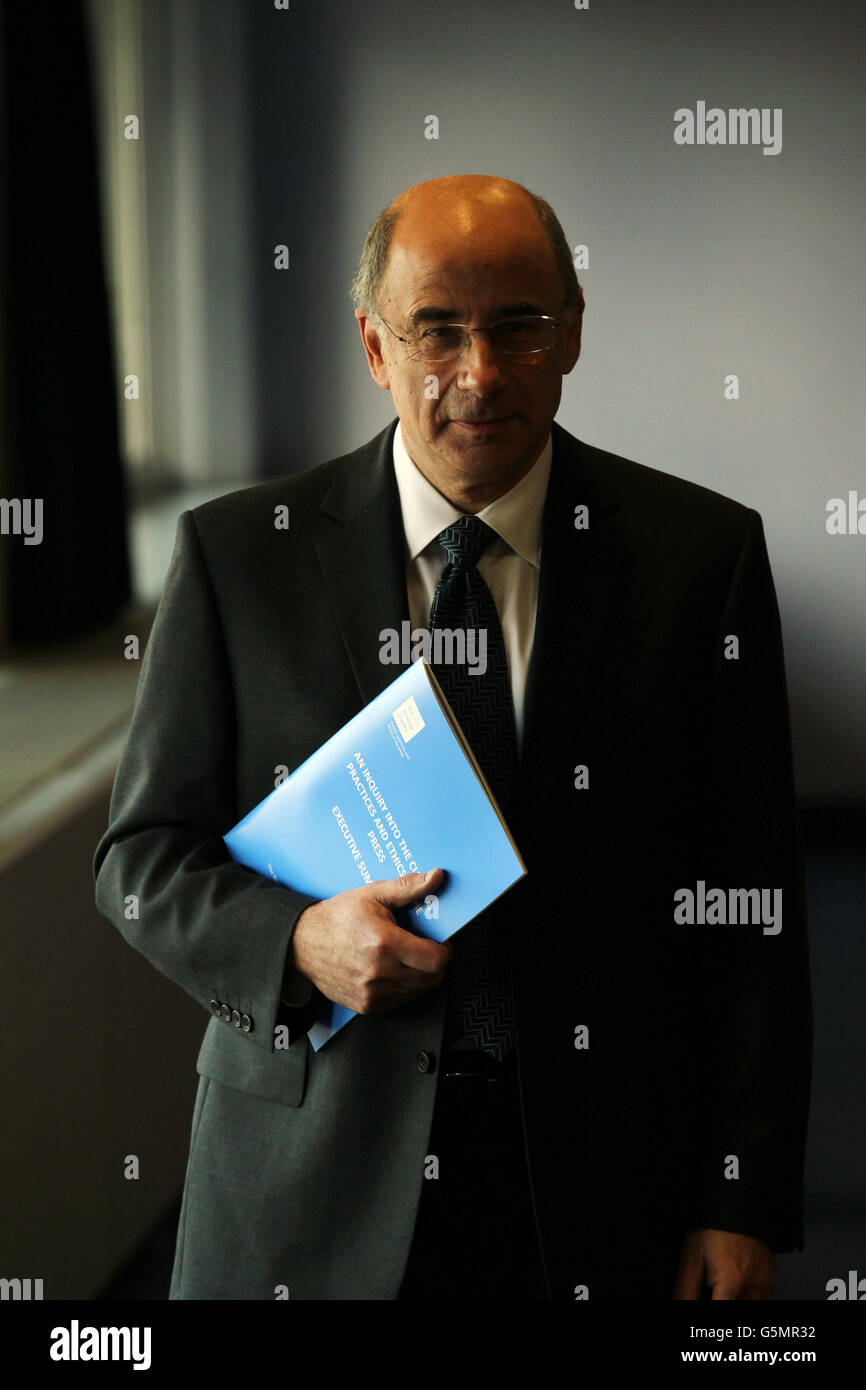 Lord Justice Leveson with the Report from the Inquiry into the Culture ...