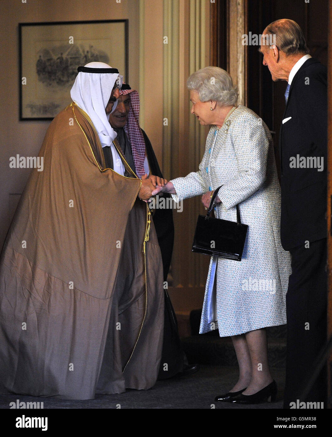 Britain's Queen Elizabeth II (R) and Prince Philip say goodbye to ...