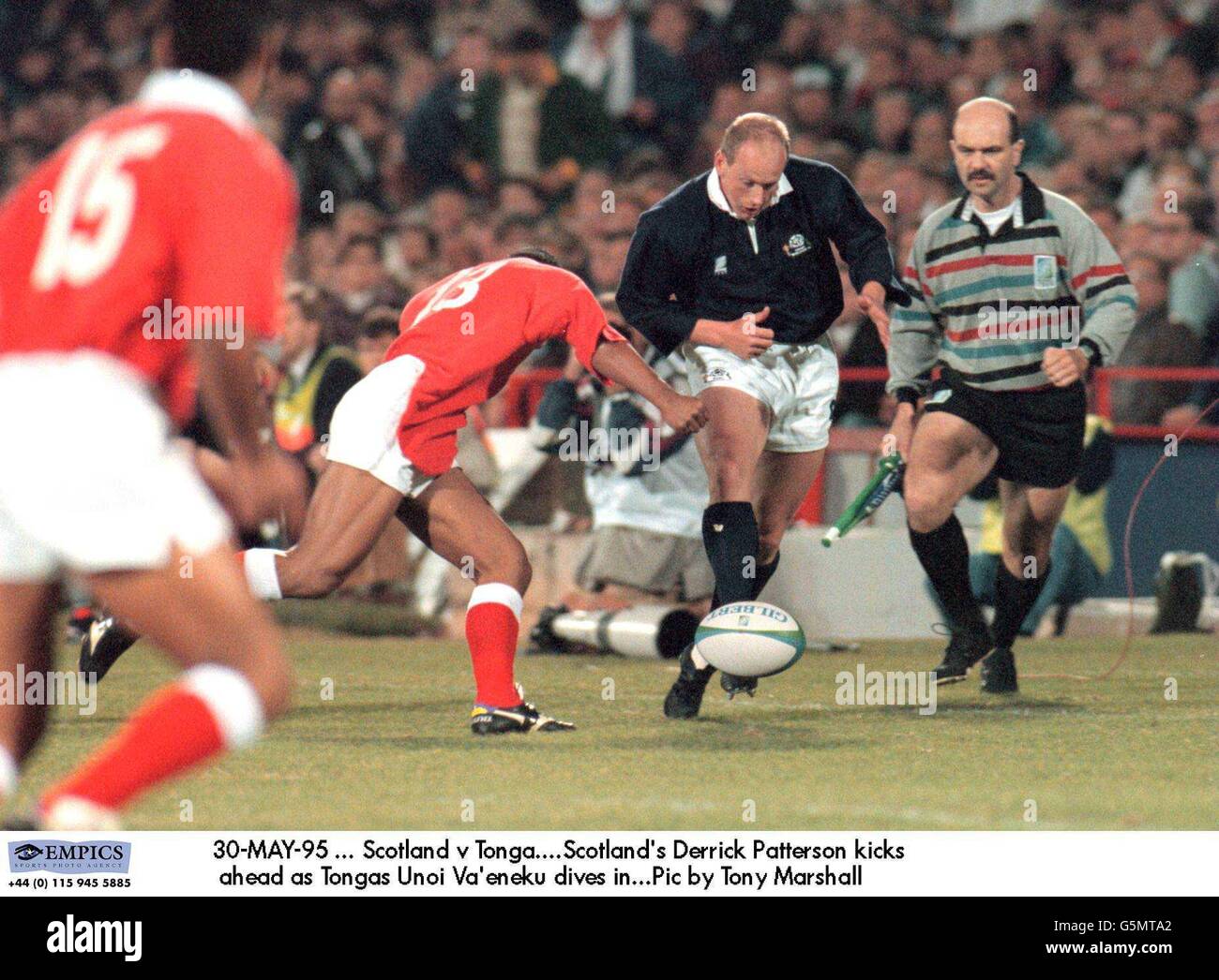 30-MAY-95. Scotland v Tonga. Scotland's Darrick Patterson kicks ahead ...