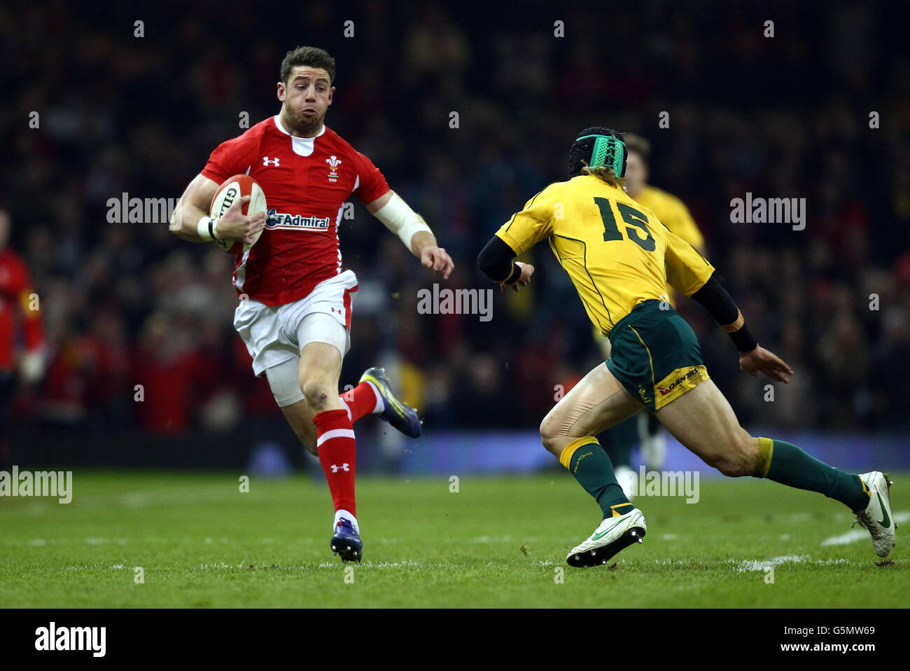 Wales' Alex Cuthbert tries to evade Australia's Berrick Barnes during ...