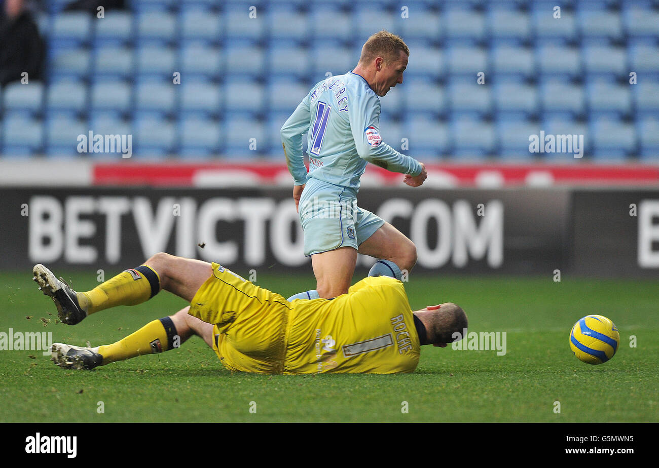 Coventry City's Gary McSheffrey is brought down by Morecambe's Barry ...
