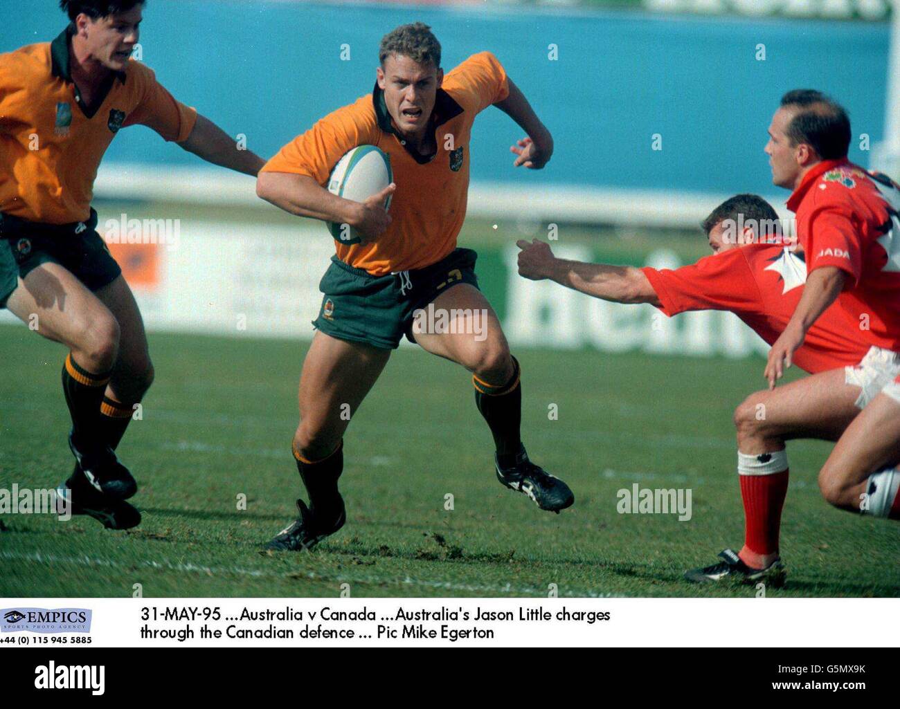 Jason little aus charges through the canadian defence hi-res stock ...