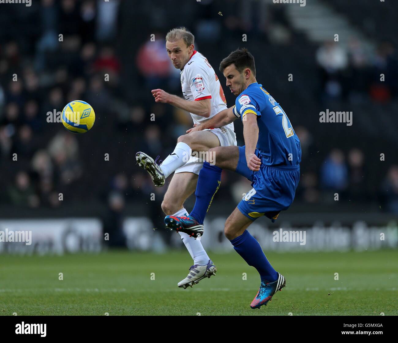 Milton Keynes Dons' Luke Chadwick (left) and AFC Wimbledon's Steven ...