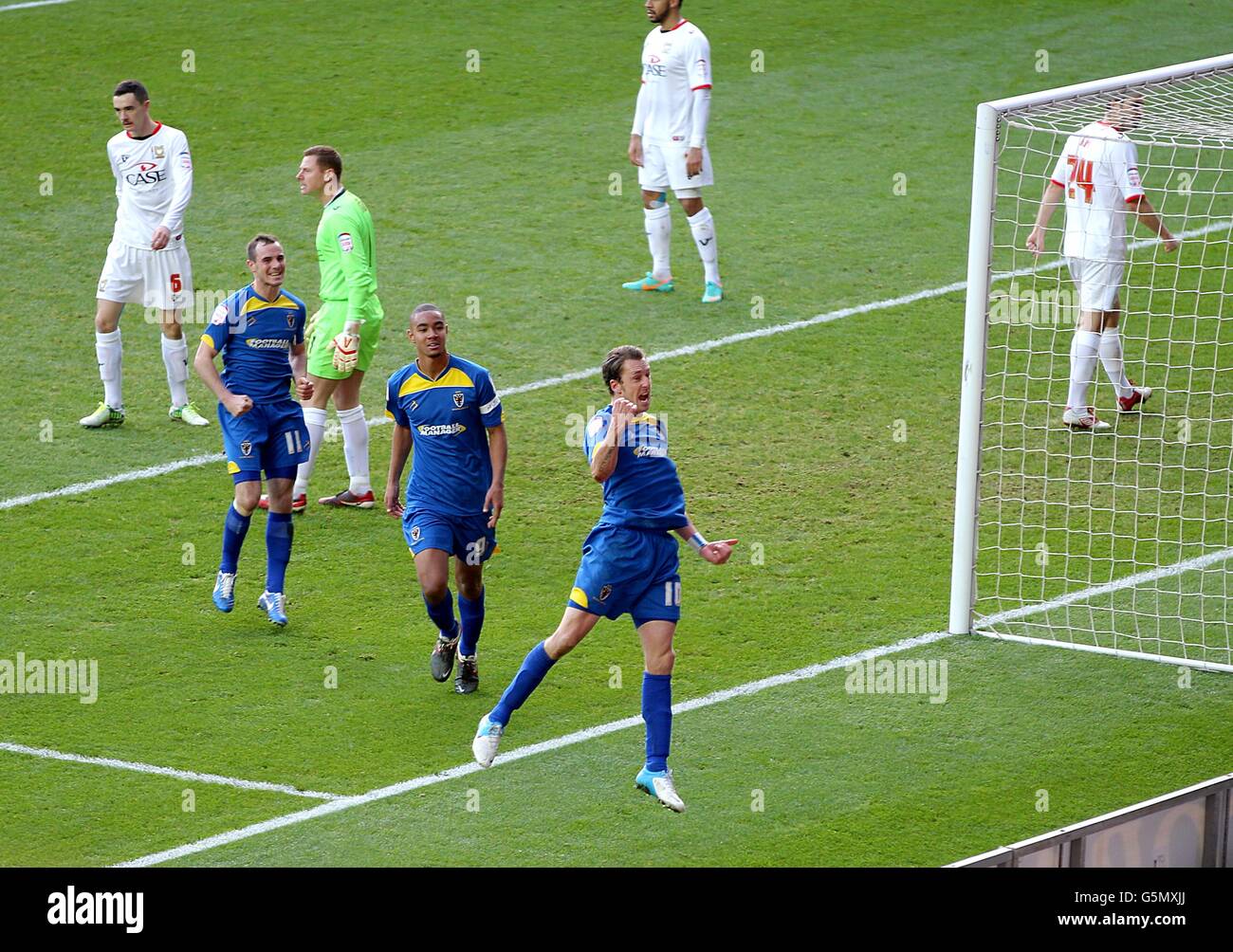 AFC Wimbledon's Jack Midson celebrates scoring his team's opening goal ...