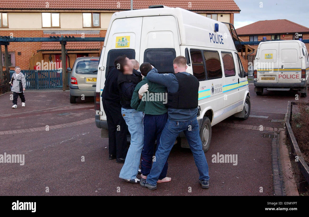 Arrest police officers police car house hi-res stock photography and ...