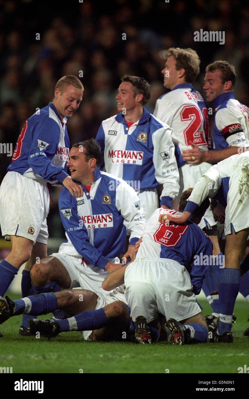 Jeff Kenna is mobbed by Blackburn Rovers players after scoring the 1st ...