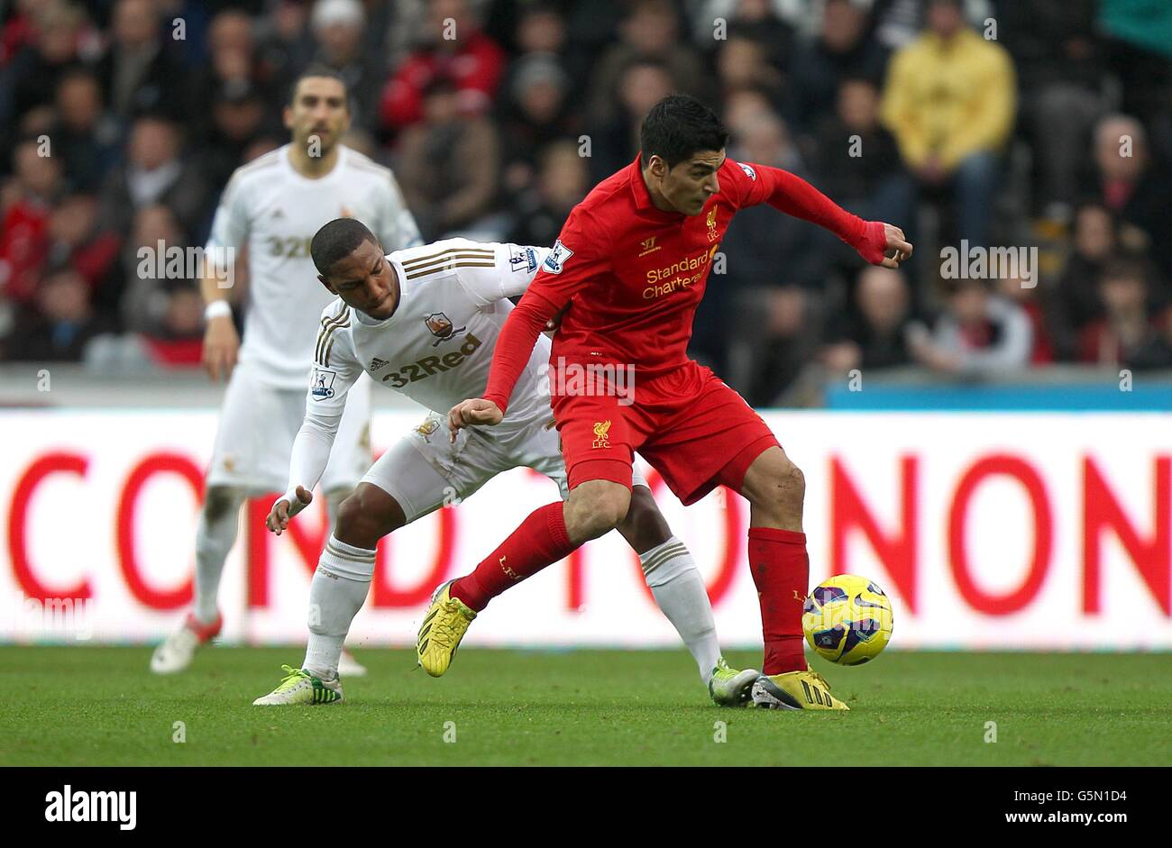 Liverpool's Luis Suarez and Swansea City's Jonathan de Guzman (left ...