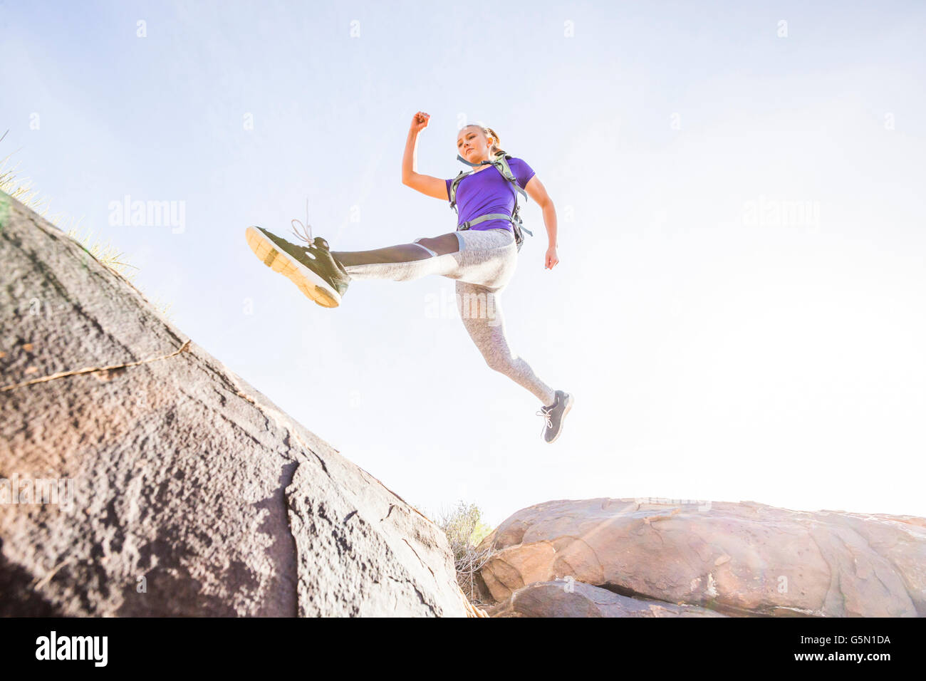 Leaping over rock hi-res stock photography and images - Alamy