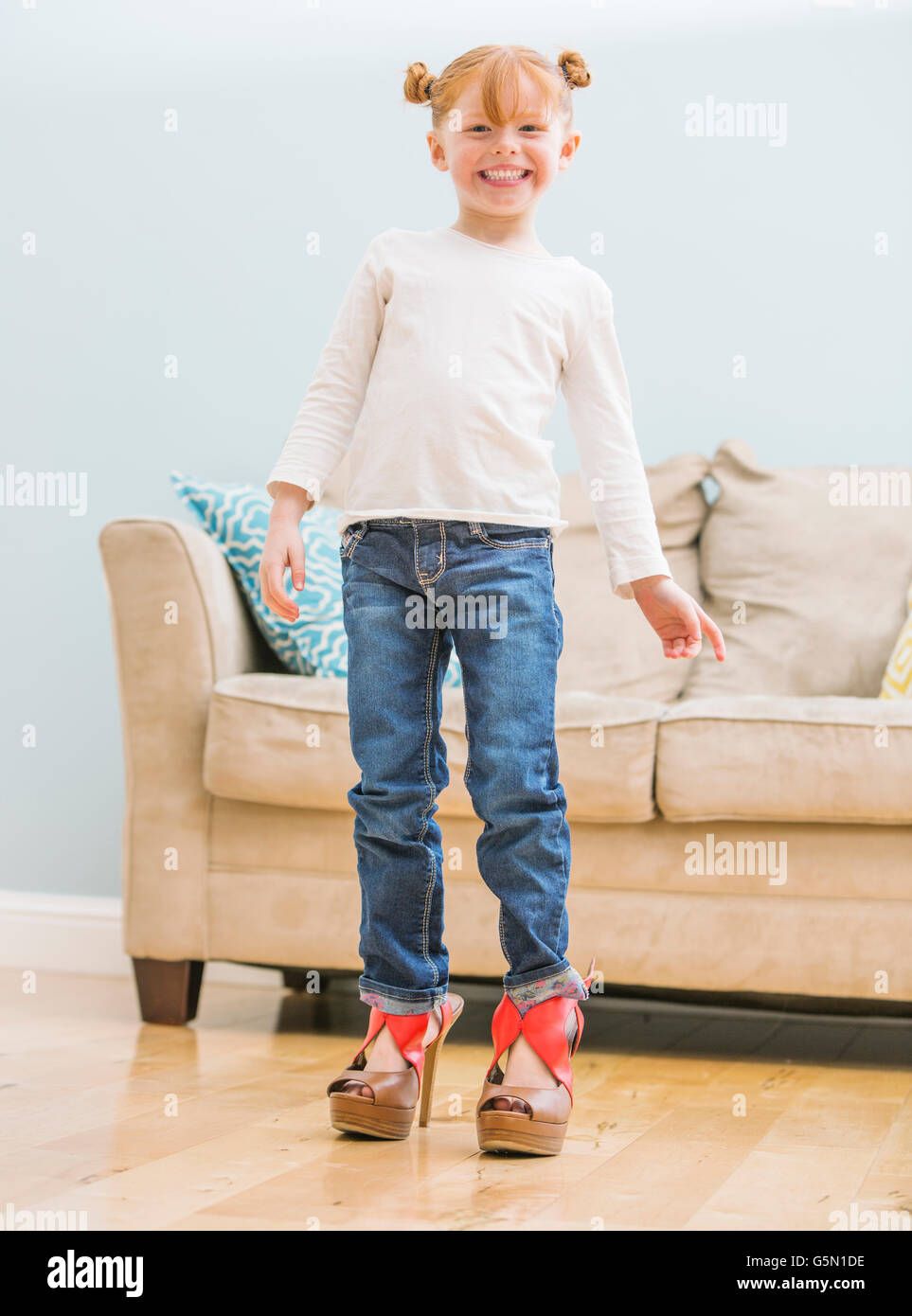 Kid wearing big shoes hi-res stock photography and images - Alamy