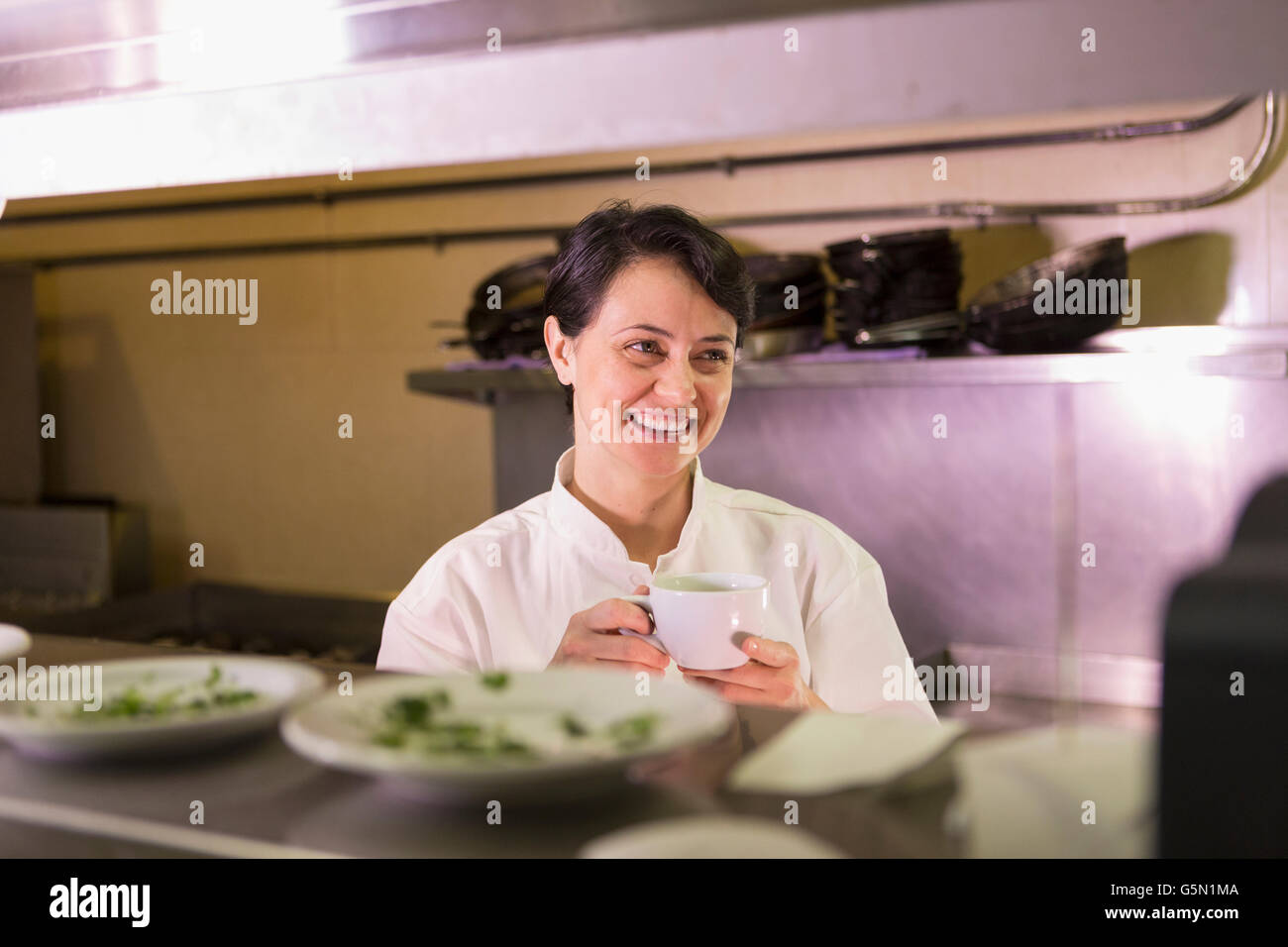 Caucasian chef smiling in restaurant kitchen Stock Photo - Alamy