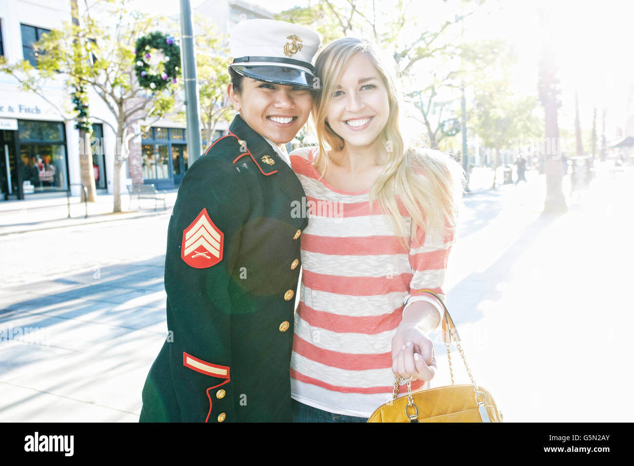 Asian soldier and friend smiling outdoors Stock Photo - Alamy