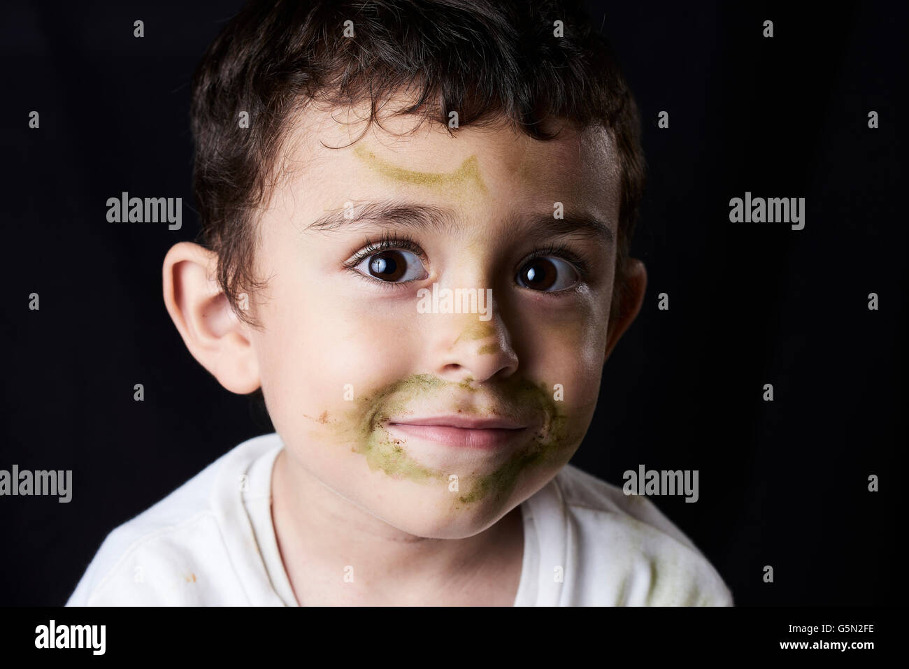 Close up of Hispanic boy with messy face Stock Photo - Alamy
