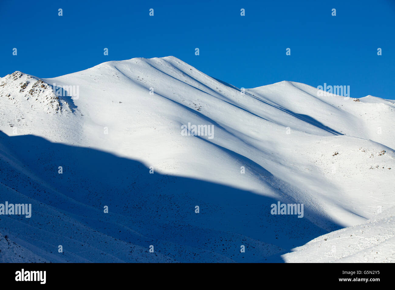 Snowy mountains in remote landscape Stock Photo - Alamy