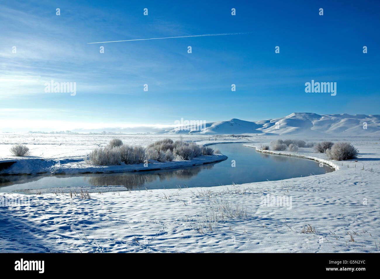 Snowy mountains and river in remote landscape Stock Photo - Alamy