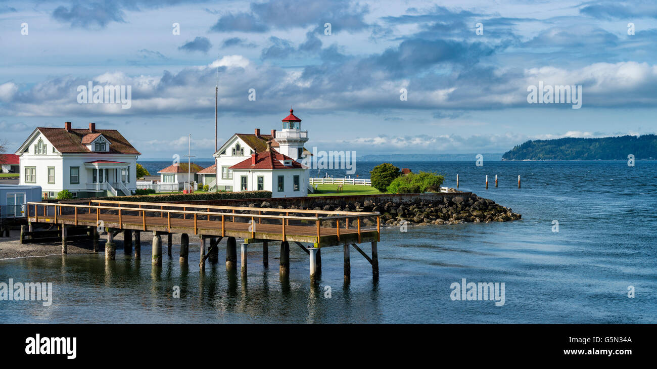 Dock and buildings on scenic coastline Stock Photo - Alamy