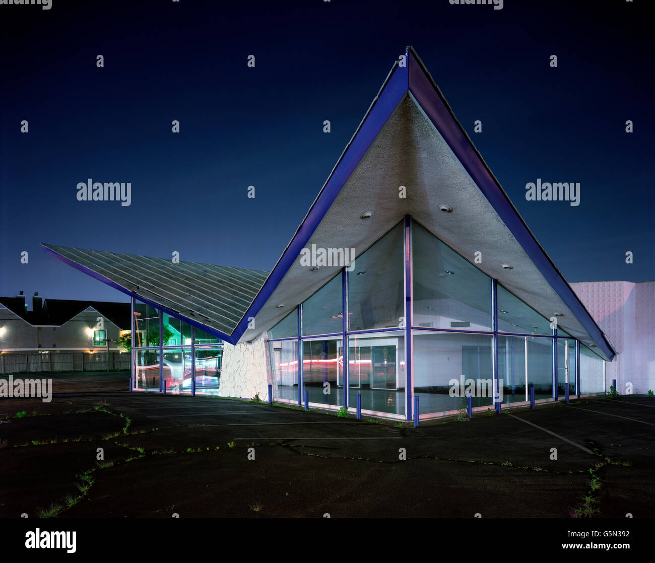Modern building illuminated at night Stock Photo - Alamy