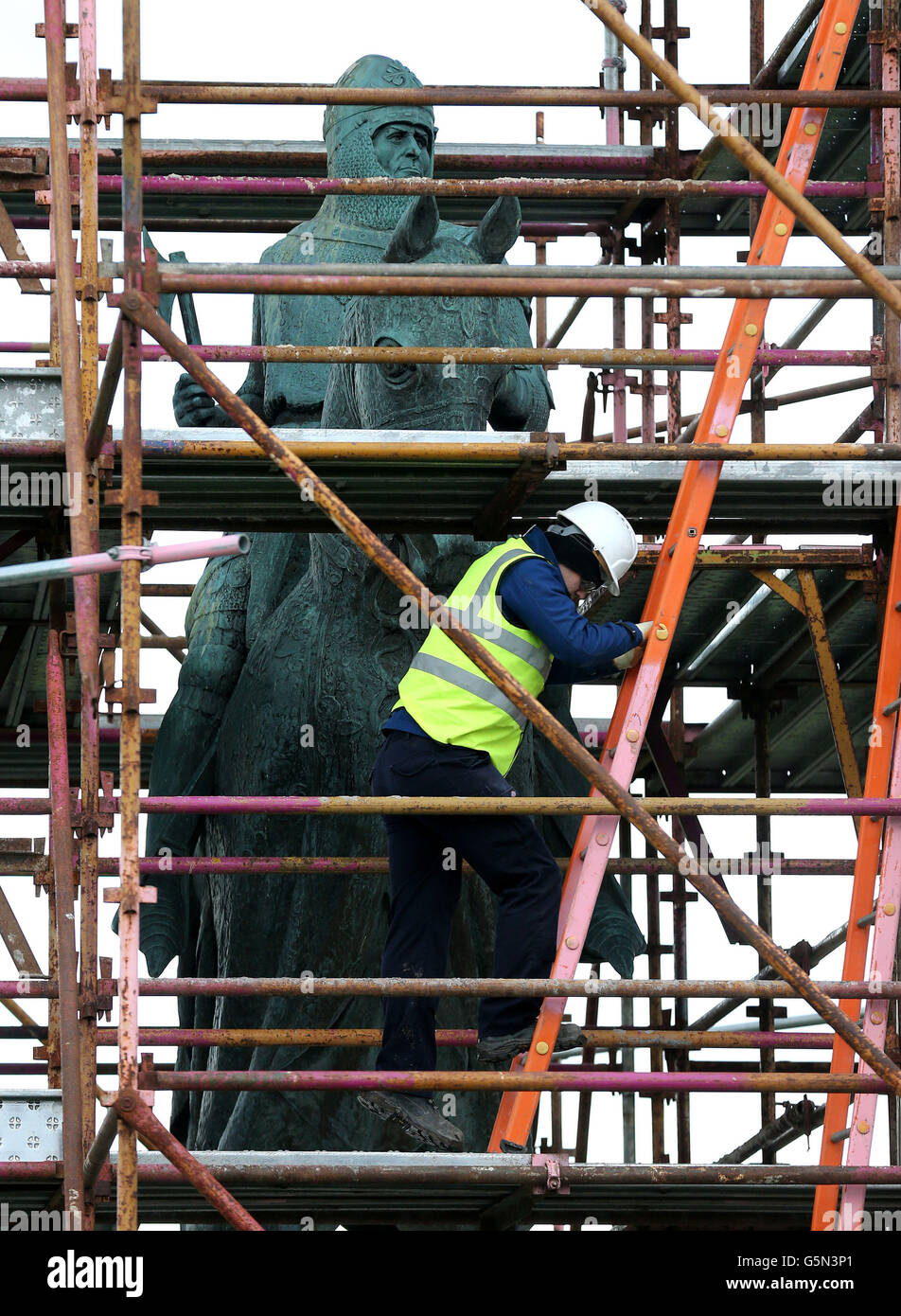 Historic Scotland apprentice stone mason Liam Grubb, climbs on ...