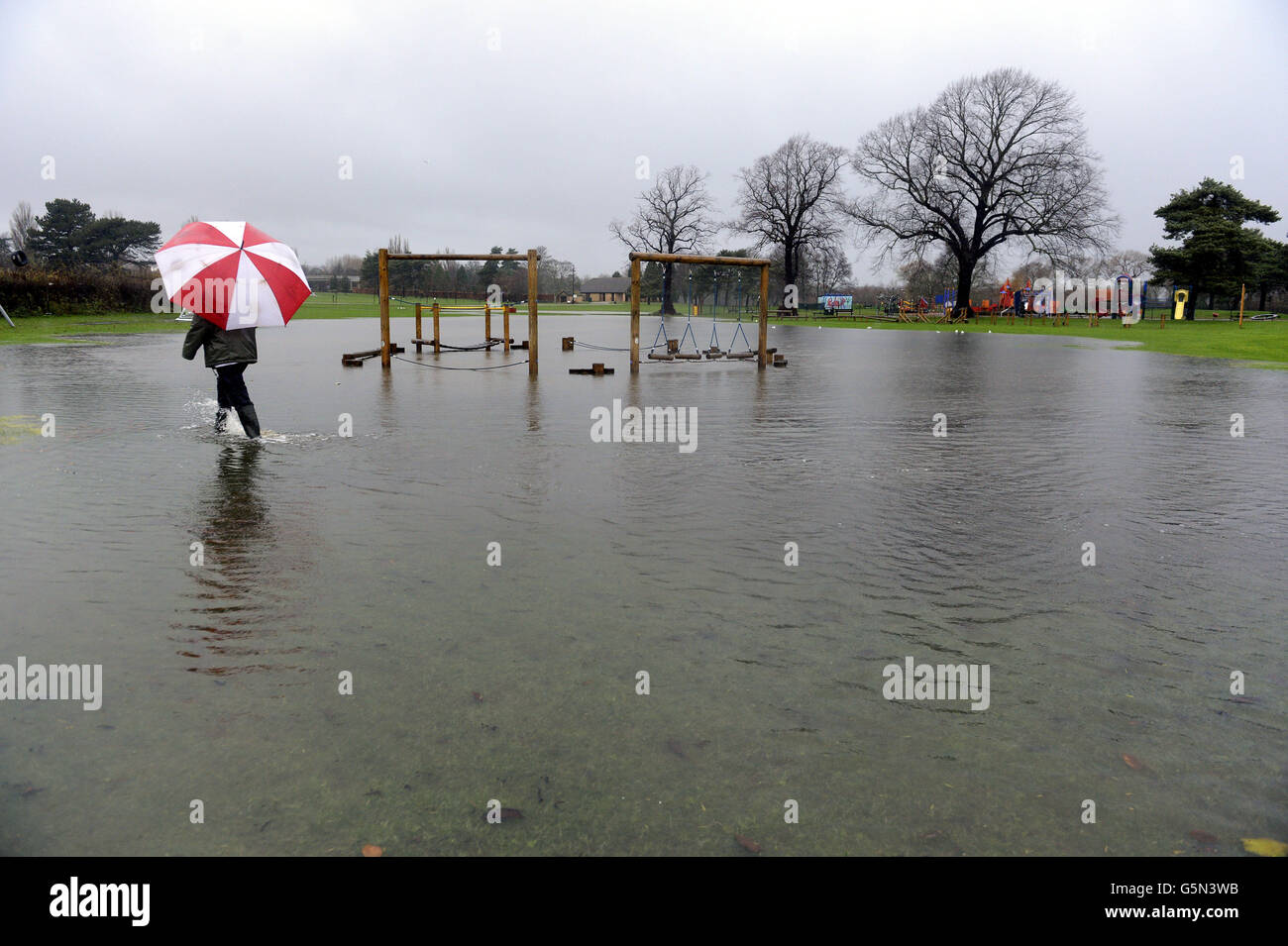 A person strides through Riverside park in Chester-Le-street, flooded ...