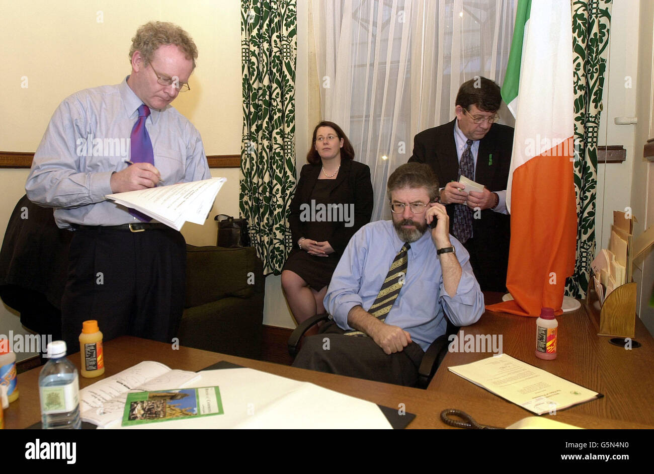 Sinn Fein President Gerry Adams (seated) inside his new office at the ...